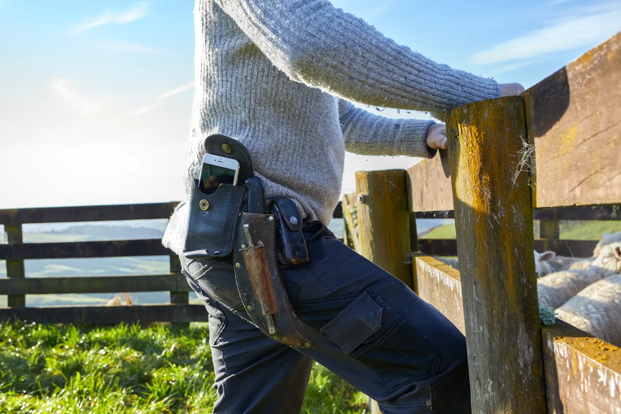 Farmer's belt with mobile and knife