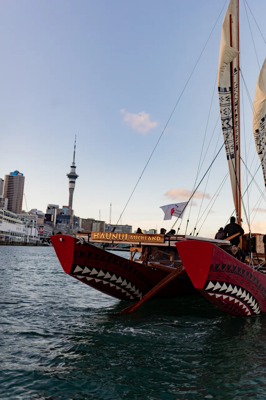 Waka Hourua sailing past the Sky Tower