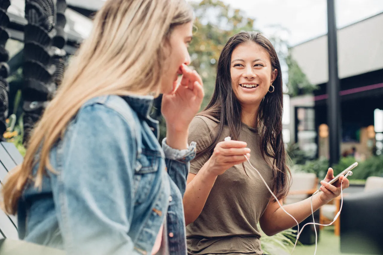Two girls interacting with each other